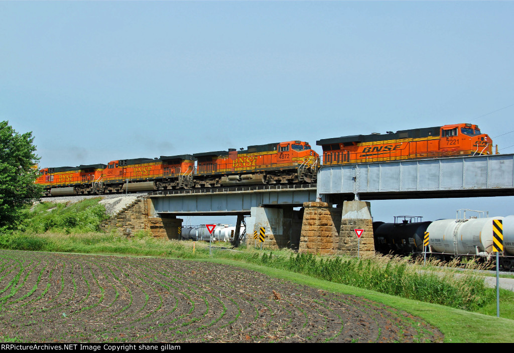 BNSF 7221 Leads a Eb z train.